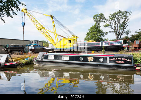 Boatyard on Shropshire Union Canal with crane surrounded by classic ...