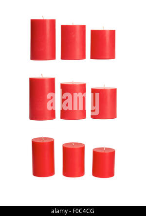 White candles with a red wick on a light background Stock Photo - Alamy
