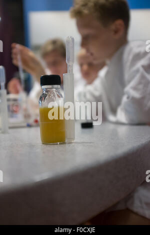 Kid and teacher doing science experiments. back to school concept Stock ...