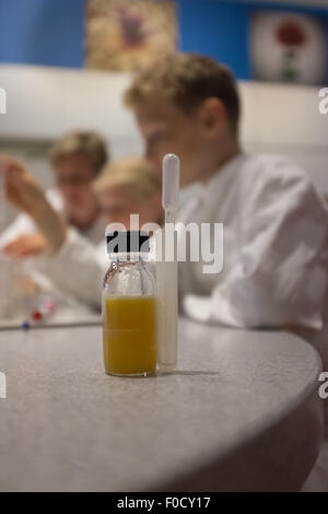 Kid and teacher doing science experiments. back to school concept Stock ...