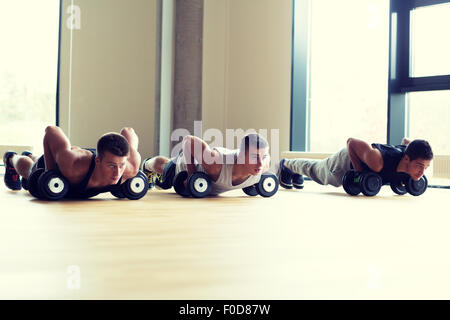 group of men with dumbbells in gym Stock Photo - Alamy