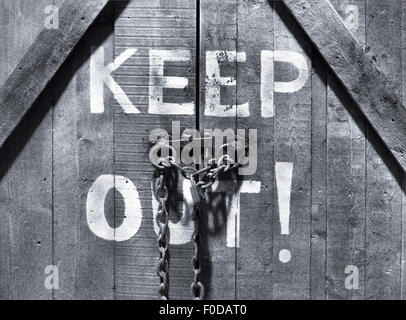 A closeup of Keep Out Sign on a white metal fence Stock Photo - Alamy