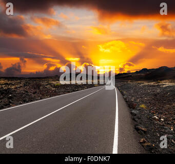 fantastic sunset over asphalt road Stock Photo - Alamy