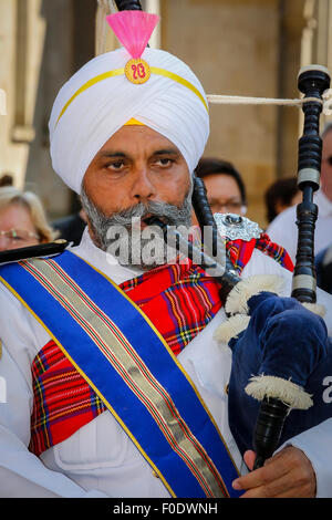 Sikh musicians play traditional musical instruments in the grounds of ...