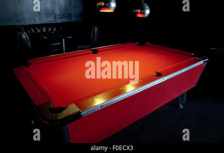 Red pool billiards table in dark rock club, 2015 Stock Photo - Alamy