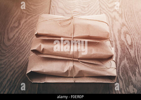 vintage style parcels wrapped with rope, close up photo Stock Photo - Alamy