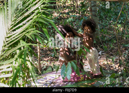 Woman of the Orang Asil tribe sitting in the jungle, natives ...