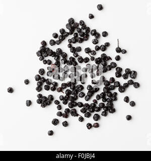 a with some berries on a white surface Stock Photo - Alamy