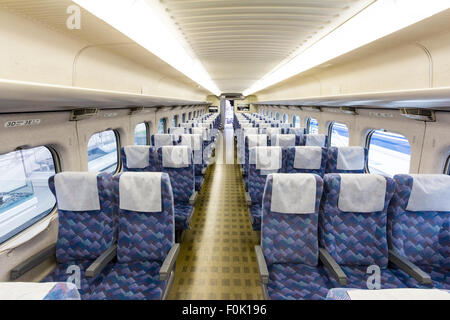 Interior of Shinkansen, Bullet train, carriage with three seats on one side, two on other and ...