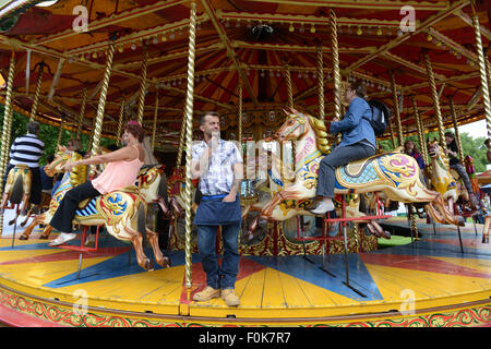Traditional British 'merry go round'. A fairground ride based on Stock ...