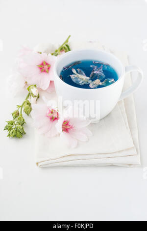 Cup of Mallow tea and blossoms Stock Photo - Alamy