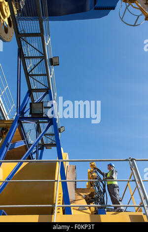 Man working onboard a ship Stock Photo - Alamy