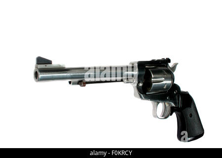 A stainless steel .357 magnum revolver on a reflective surface with a ...