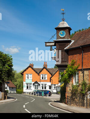 Historic clock overhanging the road at Abinger Hammer Surrey England ...