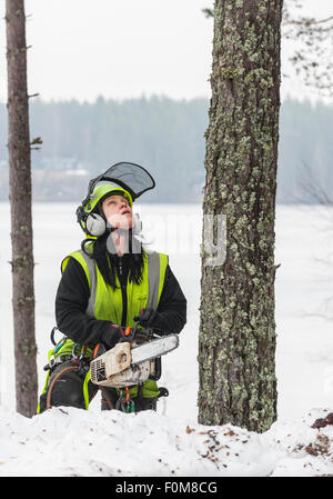 Woman with chainsaw Stock Photo - Alamy