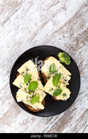European style sandwiches with Roquefort cheese and Basil leaves on ...