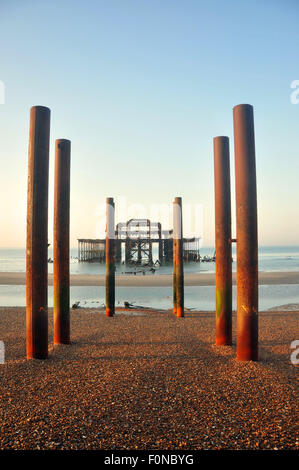 Ruined West Pier at Brighton in East Sussex, England. Evening sunset ...