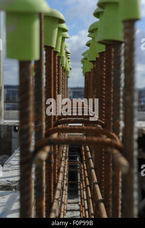 Concrete rebar with caps Stock Photo - Alamy