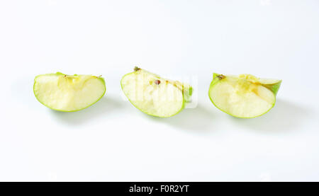 Fresh green apple wedges - studio shot Stock Photo - Alamy