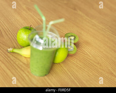 A selective focus shot of a green smoothie on the table Stock Photo - Alamy