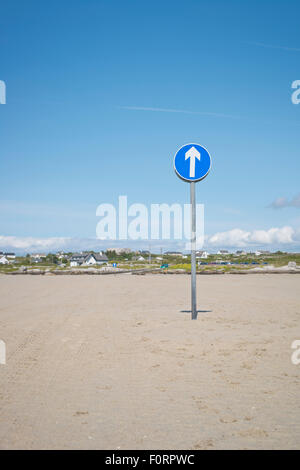 Signs showing the beach route to Omey Island Stock Photo - Alamy