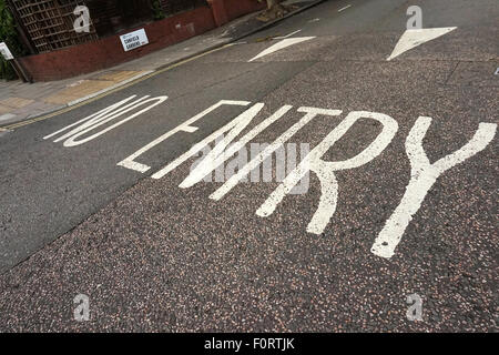 a british no entry sign, a speed limit sign, and a notice restricting ...