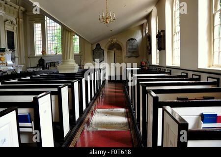 Philadelphia, Pennsylvania: White boxed wooden pews with red and blue ...