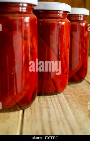 Glass jar with pickled red bell pepper Stock Photo - Alamy