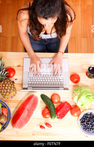 Cooking with some help from a Laptop Stock Photo - Alamy