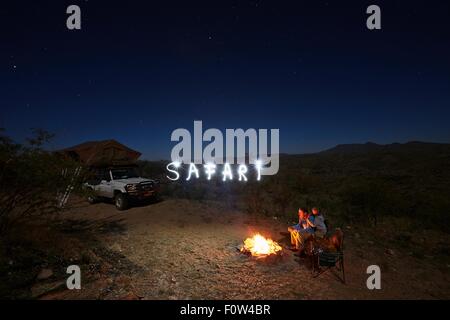 Family at campfire, Gamsberg Pass, Namibia Stock Photo - Alamy