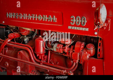 Detail view of a 1950's International 300 Utility harvester tractor ...