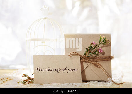 Beige cardboard box with tag and message inscription Thank you, on ...