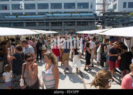 Visitors of the "feel good market" at the former Philips territory ...