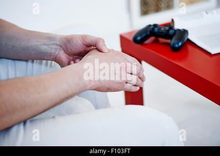 MAN WITH PAINFUL HAND Stock Photo - Alamy