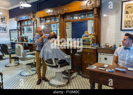 NYC local neighborhood barber shop Stock Photo - Alamy