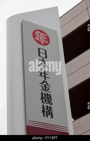 A sign of Japan Pension Service (JPS) on display outside the building ...