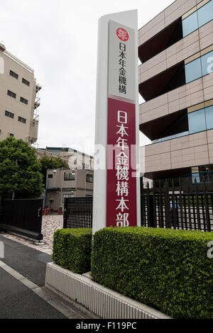 A sign of Japan Pension Service (JPS) on display outside the building ...