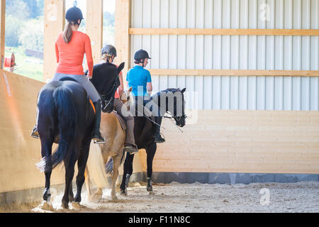 Riding lesson riding hall Stock Photo - Alamy