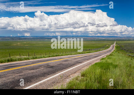 A roadway with storm clouds forming in rural Utah, USA Stock Photo - Alamy
