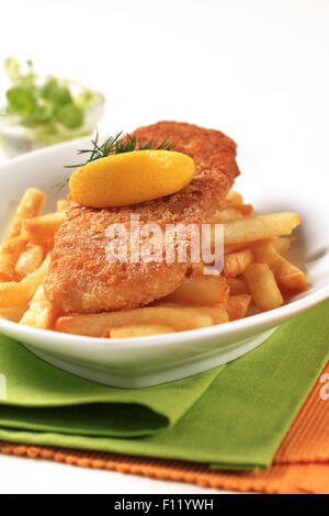 Fried fish fillet with french fries on white background Stock Photo - Alamy