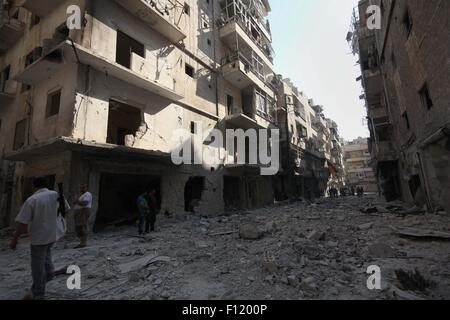 Aug. 25, 2015 - Aleppo, Syrian Arab Republic - Syrian men walk on the ...