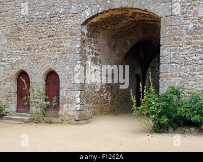 Stone arched door inside the walls of the medieval military fort which ...