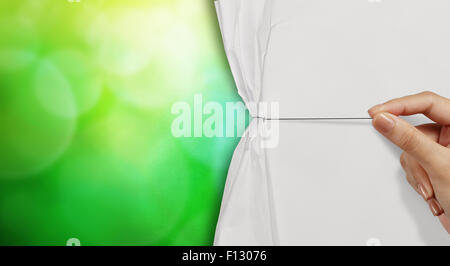 hand open crumpled paper to show dream house and green nature ...