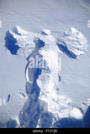 Snow angel in winter and Footprints in the snow Stock Photo - Alamy