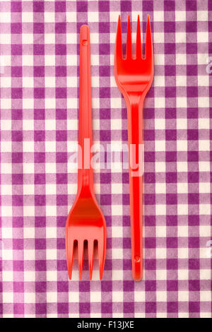Red plastic forks vertical in close up Stock Photo - Alamy