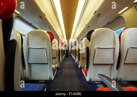Seating and aisle of an empty railway carriage interior of a Northern ...