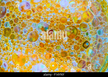 Oil on water forms interesting colours and shapes Stock Photo - Alamy