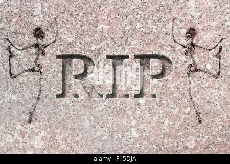 Engraved headstone spelling the letters RIP with Skeletons - rest in ...