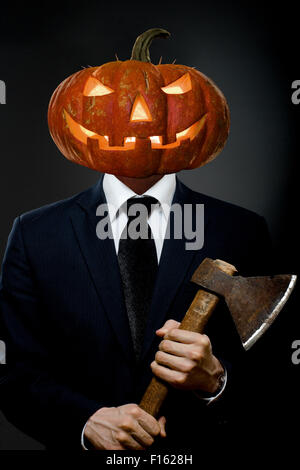 Sinister man in costume of Halloween crazy zombie with bloody wounded ...