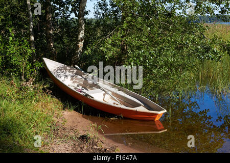stranded row boat, Finland Stock Photo - Alamy